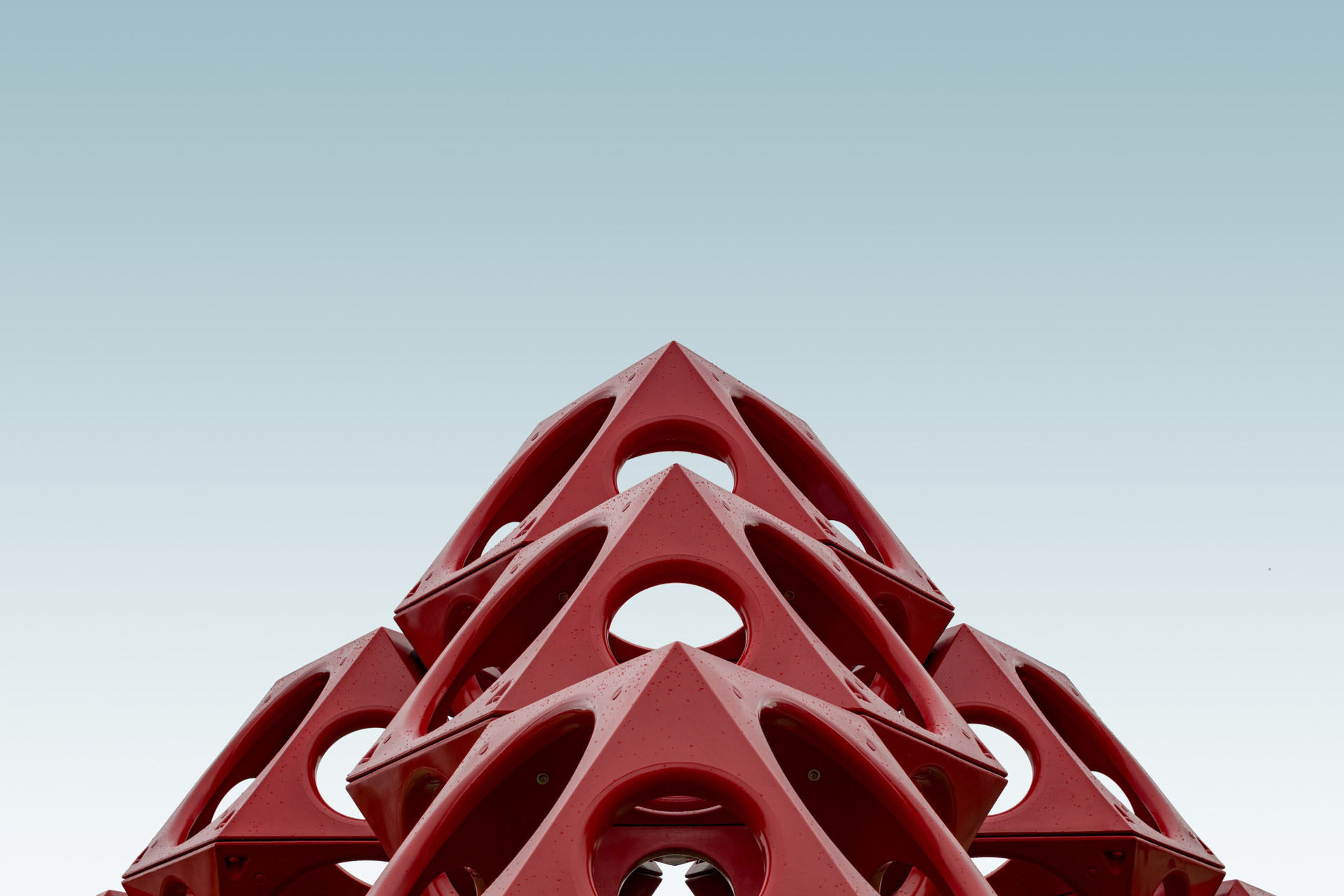 low-angle-red-geometrical-structure-blue-sky – Jaredian Design Group